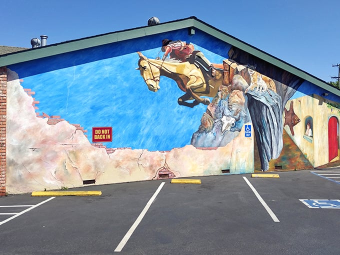 The cowboy mural leaping across this Santa Cruz diner's exterior isn't just decoration—it's a promise of the wild west of flavor waiting inside.