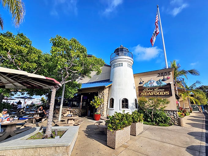 The lighthouse-shaped entrance isn't just architectural whimsy—it's a beacon calling seafood lovers home to this San Diego institution.