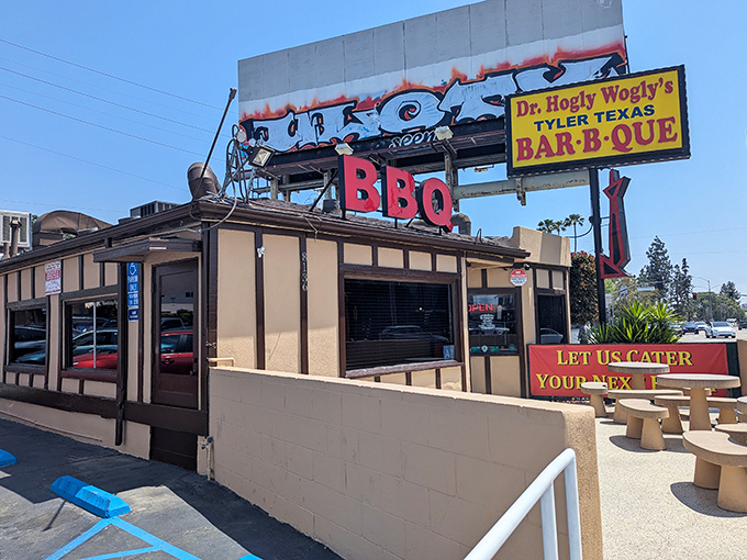 The sign alone is worth the drive—bold, unapologetic, and promising smoky delights that'll make your cardiologist wince and your taste buds rejoice.