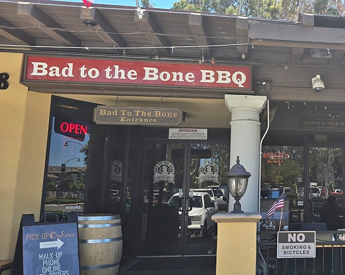 The unassuming exterior of Bad to the Bone BBQ belies the smoky treasures within. Mission-style architecture meets meat paradise in San Juan Capistrano.