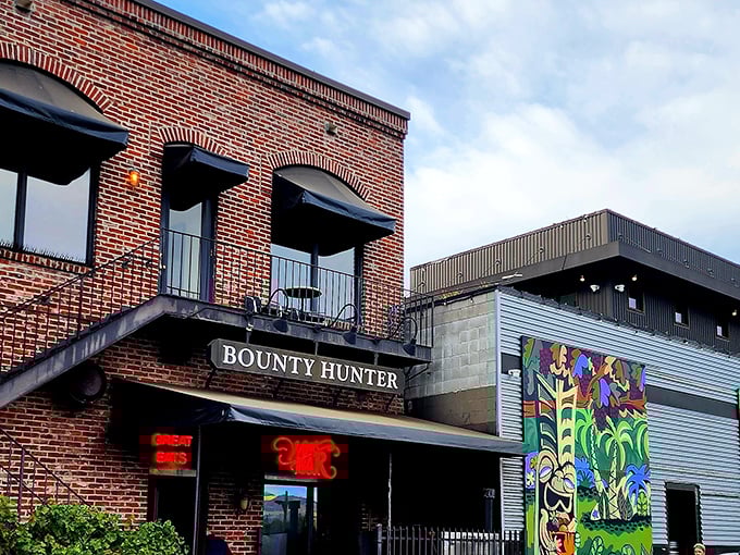 The historic brick façade of Bounty Hunter beckons from First Street in downtown Napa, promising rare wines and smoky delights behind those welcoming doors.