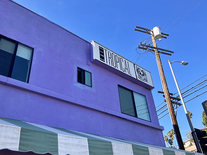 A bold splash of purple and a green-striped awning mark this corner gem in Silver Lake — Café Tropical, a beloved Cuban spot drawing food lovers from all over California.