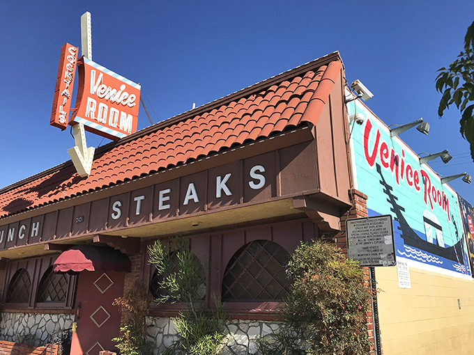 The neon sign beckons like a mid-century mirage. Venice Room's terra cotta roof and vintage façade promise a time-traveling steak adventure in Monterey Park.
