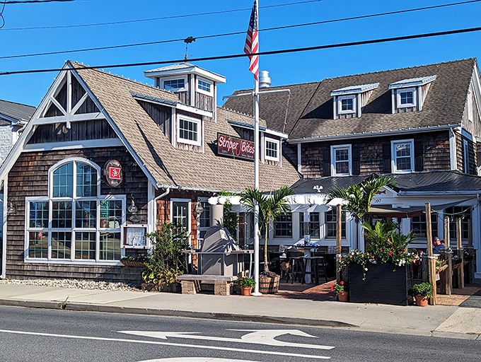 Cedar shingles, fresh flowers, and a welcoming porch – Striper Bites looks like the coastal grandma aesthetic came to life and opened a restaurant.