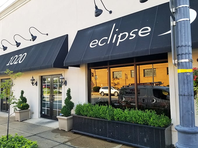 Eclipse Bistro's elegant black awnings and crisp white facade create the perfect understatement – culinary magic often hides in the most unassuming packages.