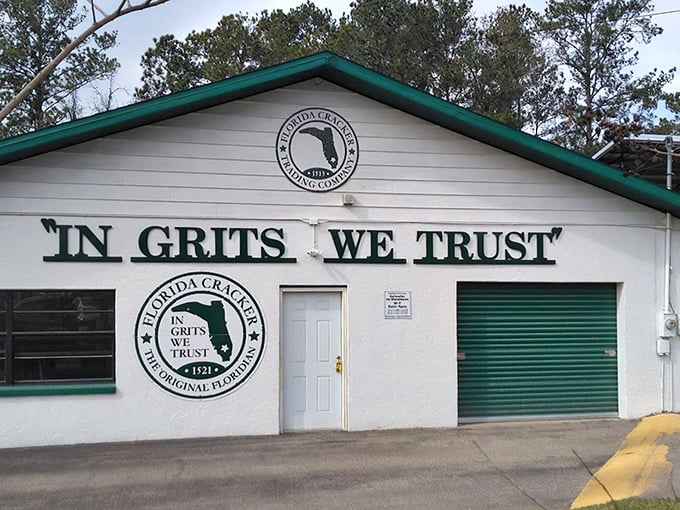The white building with "IN GRITS WE TRUST" emblazoned across the front isn't just making a statement—it's making a promise.