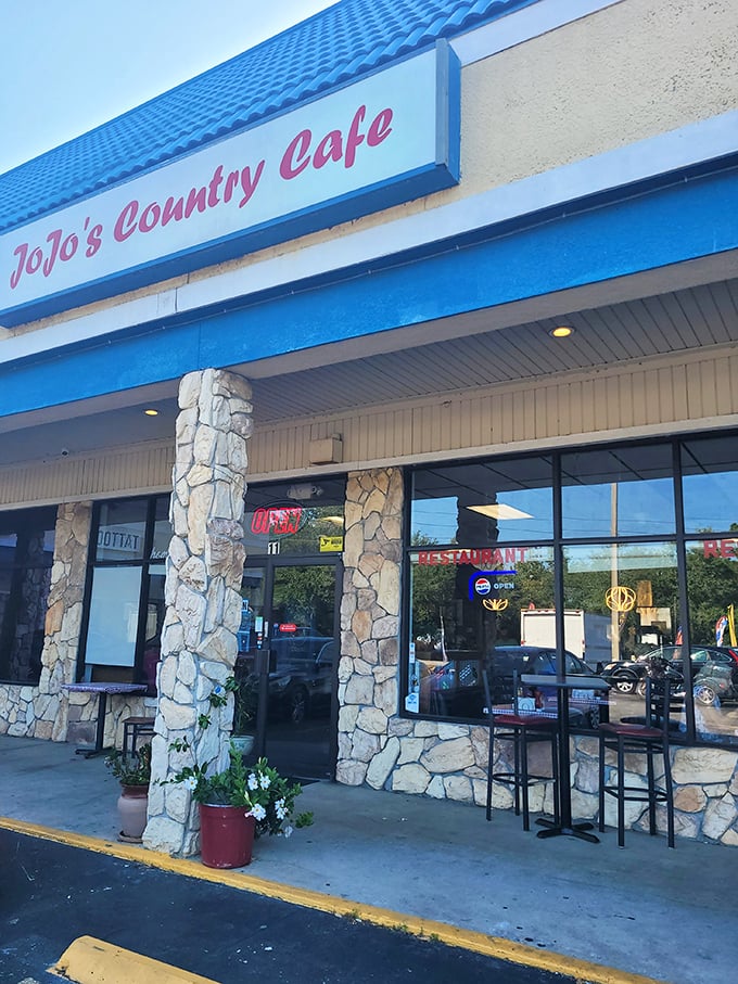That red script against the blue roof isn't just signage—it's a promise of comfort food that makes snowbirds forget why they ever considered flying back north.