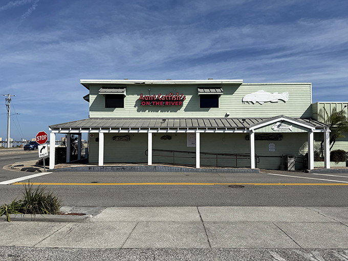 The unassuming mint-green exterior of Aunt Catfish's belies the culinary treasures within—like finding a five-star restaurant disguised as your favorite aunt's beach house.
