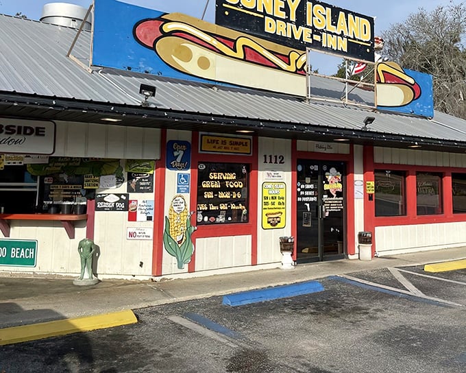 A blue and yellow sign proudly announces your arrival at hot dog paradise, where the motto might as well be "come hungry, leave happy."