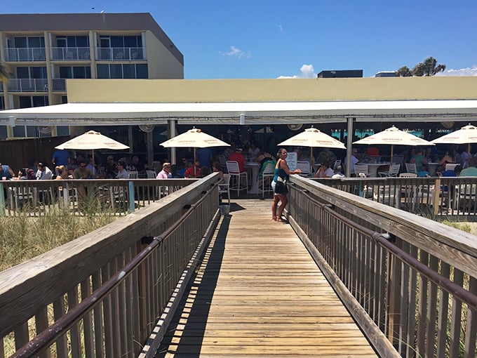 The unassuming entrance to Shuckers belies the seafood treasures within. Florida dining at its most authentic—no pretense, just promise.
