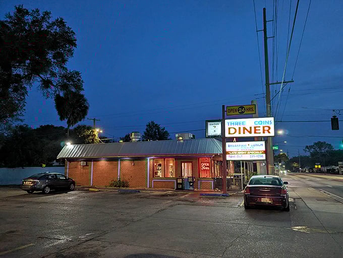 The neon glow of Three Coins Diner at dusk is like a lighthouse for hungry night owls navigating Tampa's streets.