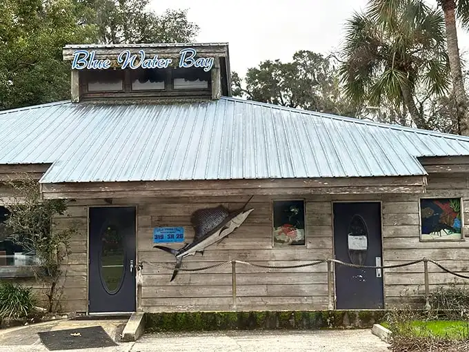 The unassuming exterior of Blue Water Bay, where that mounted marlin is basically saying, "Yes, we know what we're doing with seafood."