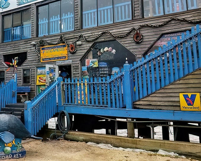 The weathered wooden exterior with its bright blue staircase isn't trying to impress anyone—until you taste what's inside. Cedar Key authenticity at its finest.