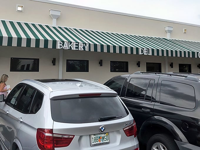 The iconic green-and-white striped awning of Wright's Gourmet House stands as a beacon to sandwich pilgrims. Tampa's culinary landmark has been drawing crowds for decades.