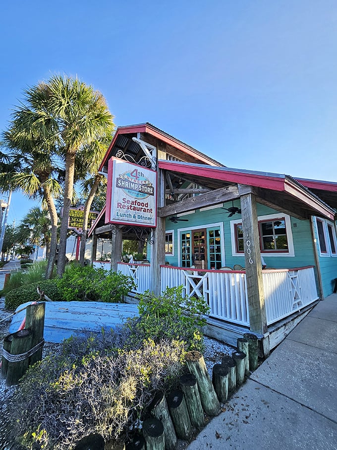 The turquoise beacon of seafood salvation! Fourth Street Shrimp Store's charming exterior, with its weathered wood and palm trees, promises Florida dining at its most authentic.