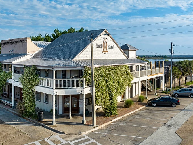 The Owl Cafe stands proudly on its corner in downtown Apalachicola, its white clapboard exterior and wraparound porch practically whispering "come on in, y'all."