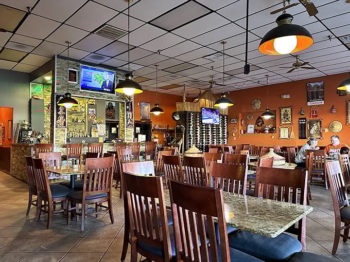 The unassuming storefront of Nile Ethiopian beckons like a culinary oasis in Orlando. Those wooden pillars aren't just supporting the roof—they're holding up flavor heaven.