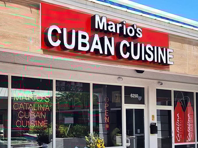 Mario's neon-lit storefront promises authentic Cuban flavors with a dash of Florida flair—like finding Havana hiding in plain sight on Federal Highway.