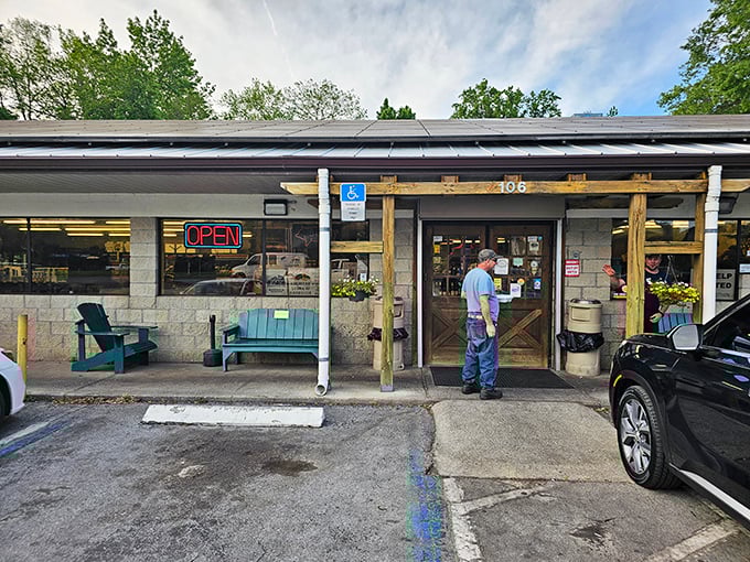 The unassuming exterior of Pearl's promises what fancy restaurants rarely deliver—authentic flavor without the fuss. Those blue benches have heard decades of post-meal satisfaction sighs.