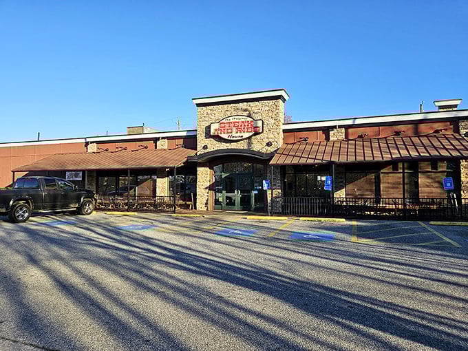 The stone facade and glowing red sign of The Original Steak & Rib House promises what every carnivore dreams of—meat prepared with respect and reverence.