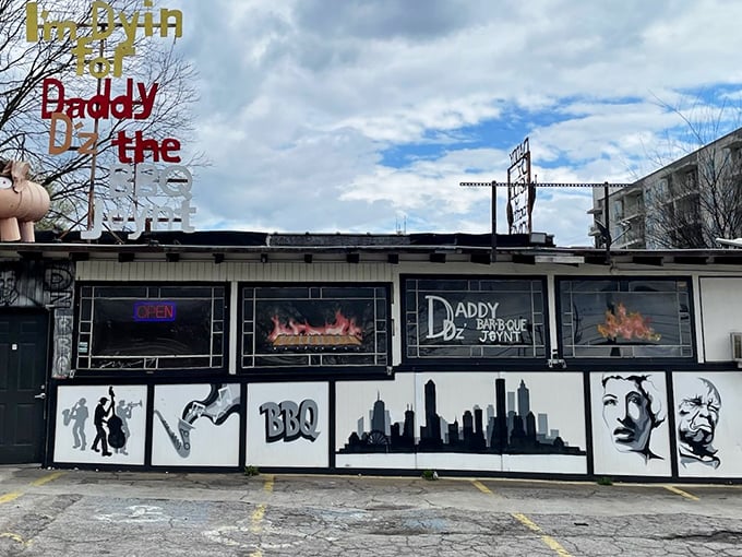 Where modern apartments meet old-school BBQ magic. The contrast between Daddy D'z weathered charm and the sleek buildings behind it tells Atlanta's evolving story.