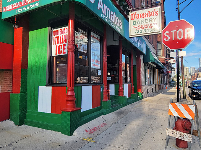 The iconic green and red storefront of D'Amato's Bakery stands as a beacon of Italian culinary tradition in Chicago's West Town neighborhood.
