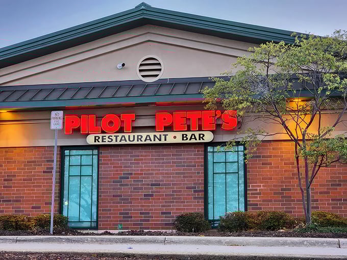 As dusk settles, Pilot Pete's neon sign glows like a runway beacon, guiding hungry travelers to this suburban oasis of comfort food and flight-inspired fun.