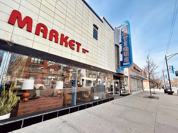 The iconic Art Deco facade of Broadway Antique Market beckons treasure hunters with its vintage signage and glimpses of wonders within.