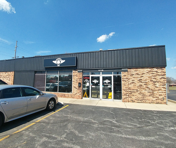The unassuming exterior of Bombers BBQ in Munster hides culinary treasures within – like finding a Picasso at a yard sale.