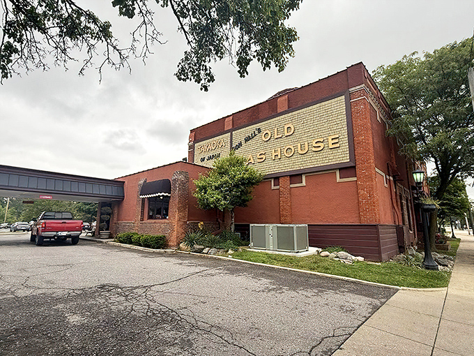 The iconic brick façade of the Old Gas House stands proudly in Fort Wayne, its golden lettering promising culinary adventures within.
