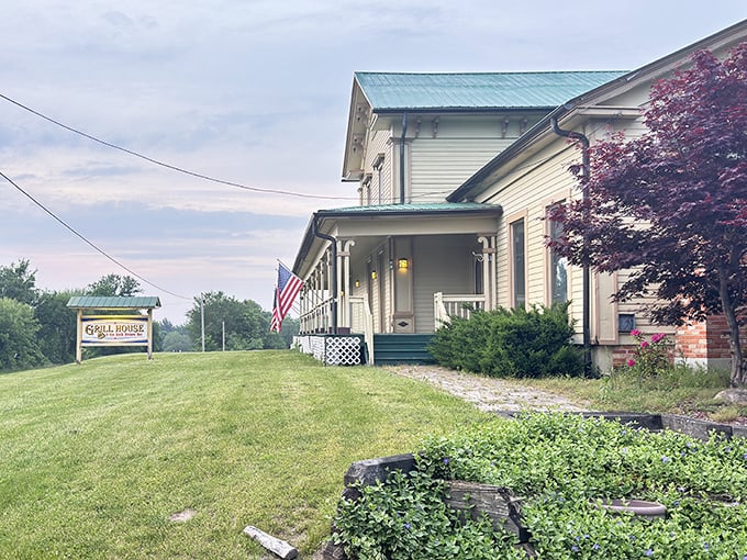 The white clapboard exterior with its distinctive turquoise roof feels like stepping into a Norman Rockwell painting where prime rib dreams come true.