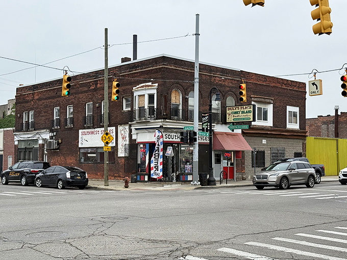 The corner brick building stands like a sentinel of sustenance, its vintage sign promising Detroit comfort food that transcends time. A culinary landmark that's seen it all. 
