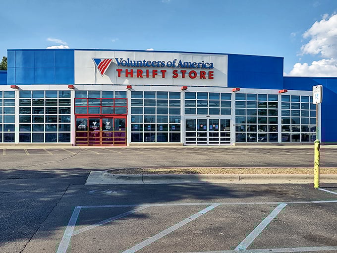 The blue and red exterior beckons like a retail lighthouse for bargain hunters. Behind those windows lie treasures waiting to be discovered by savvy Michigan shoppers.