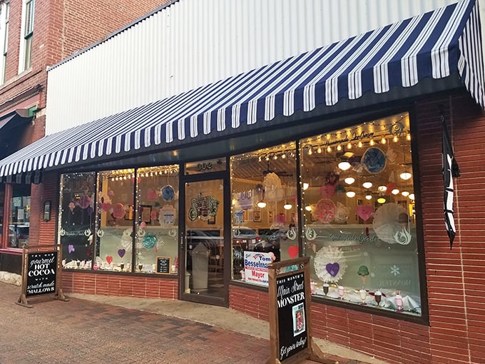 That blue and white striped awning isn't just decoration—it's a beacon of hope for anyone whose day needs a serious upgrade of sweetness.
