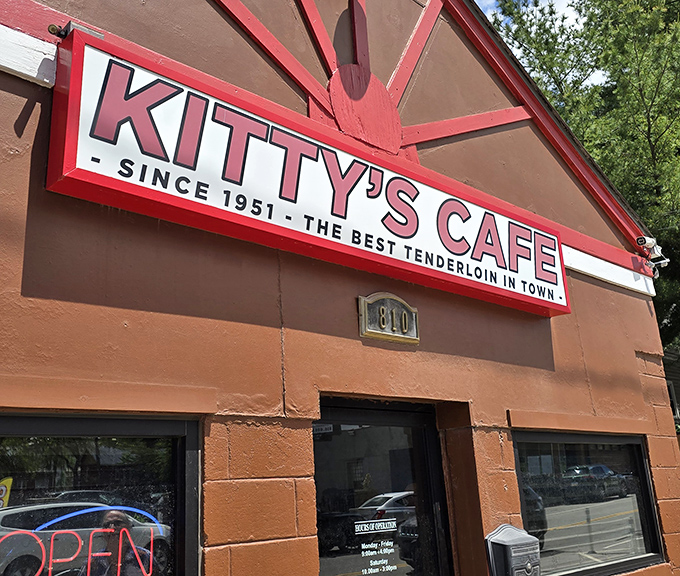 The iconic Kitty's Cafe sign promises "THE BEST TENDERLOIN IN TOWN" – a bold claim they've been backing up since Eisenhower was president.