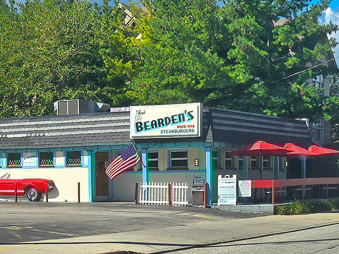 The turquoise-trimmed time machine of Rocky River beckons with its vintage sign and American flag – a burger sanctuary that's stood its ground while the world changed around it.