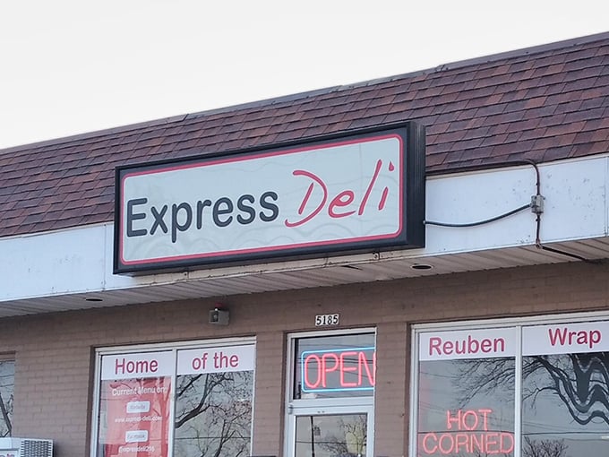 The unassuming storefront that houses culinary greatness. That neon "HOT CORNED BEEF" sign isn't just advertising—it's a promise.