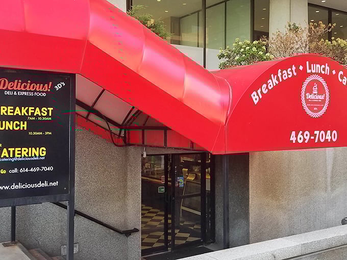 That iconic red awning stands out like a culinary lighthouse amid downtown Columbus's concrete jungle, beckoning hungry office workers to sandwich salvation.