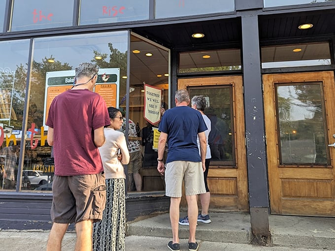 The weekend line at On The Rise proves some things are worth waiting for—artisan bread paradise just steps away.