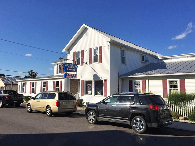 The classic white clapboard exterior of New Riegel Cafe stands like a time capsule in rural Ohio, complete with vintage striped awnings that have sheltered hungry visitors for generations.