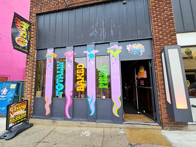 The psychedelic storefront of Totally Baked Pizza looks like what would happen if the 1970s and a box of crayons had a beautiful baby together.