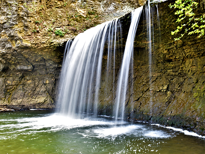 Nature's perfect curtain call – sheets of water cascade over ancient limestone, creating a mesmerizing display that seems choreographed just for you.