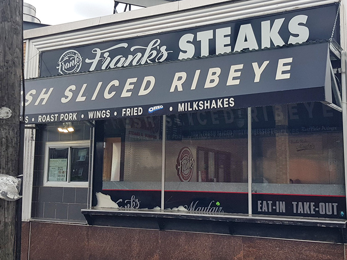 The iconic Frank's Steaks storefront beckons like a beacon of hope for the cheesesteak-deprived. That "FRESH SLICED RIBEYE" promise isn't just signage—it's a solemn vow.