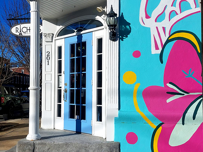 That iconic blue door isn't just an entrance—it's a portal to crepe paradise. The vibrant mural beside it hints at the colorful culinary adventure waiting inside.