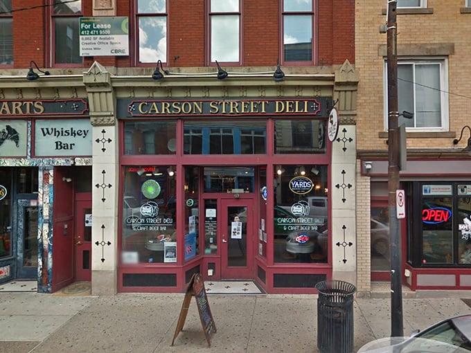 The iconic red storefront of Carson Street Deli stands proudly on Pittsburgh's South Side, a beacon for sandwich pilgrims seeking pastrami perfection.