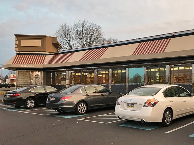 The classic diner silhouette against Pennsylvania sky – where breakfast dreams come true and diet plans go to die.