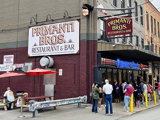The Strip District legend stands ready for another day of sandwich architecture that defies physics and common sense.