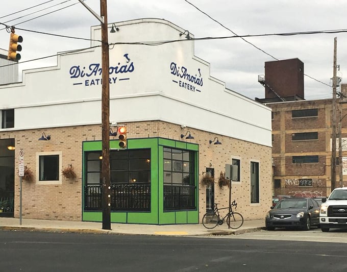 By day, this Strip District gem stands proud with its crisp white facade and signature green accent—Pittsburgh's little slice of Italy.