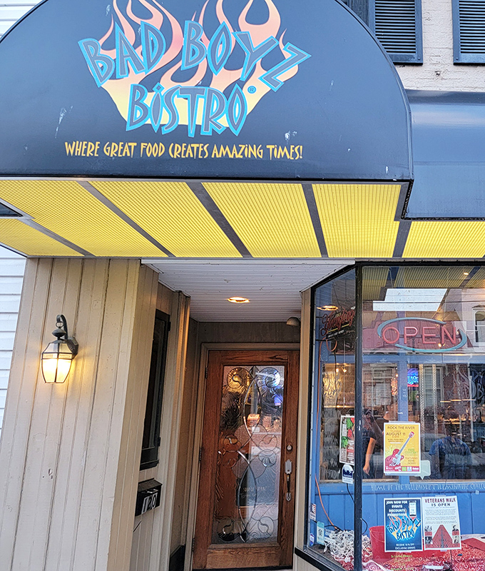 The iconic Bad Boyz Bistro sign promises "great food creates amazing times" – a bold claim that somehow still manages to undersell what awaits inside.