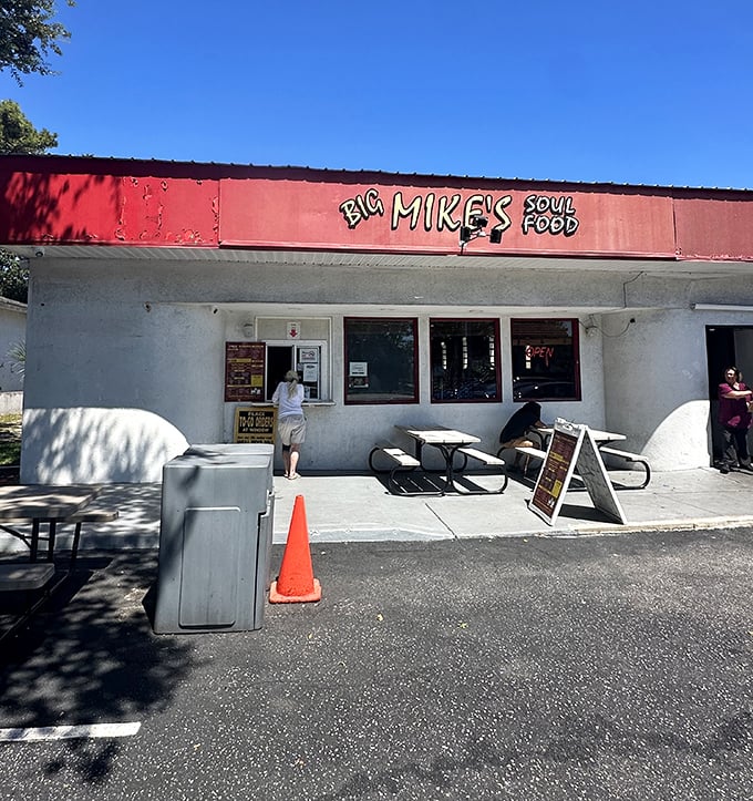 The unassuming red-topped exterior of Big Mike's Soul Food – where culinary magic hides behind modest walls, proving the best treasures don't need fancy packaging.